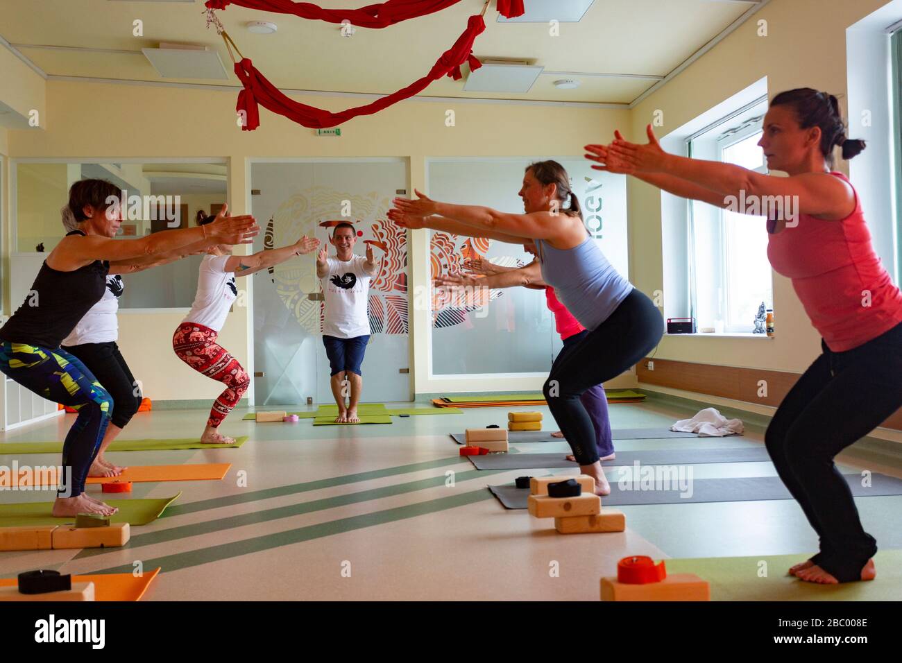 Yoga class in progress Stock Photo - Alamy