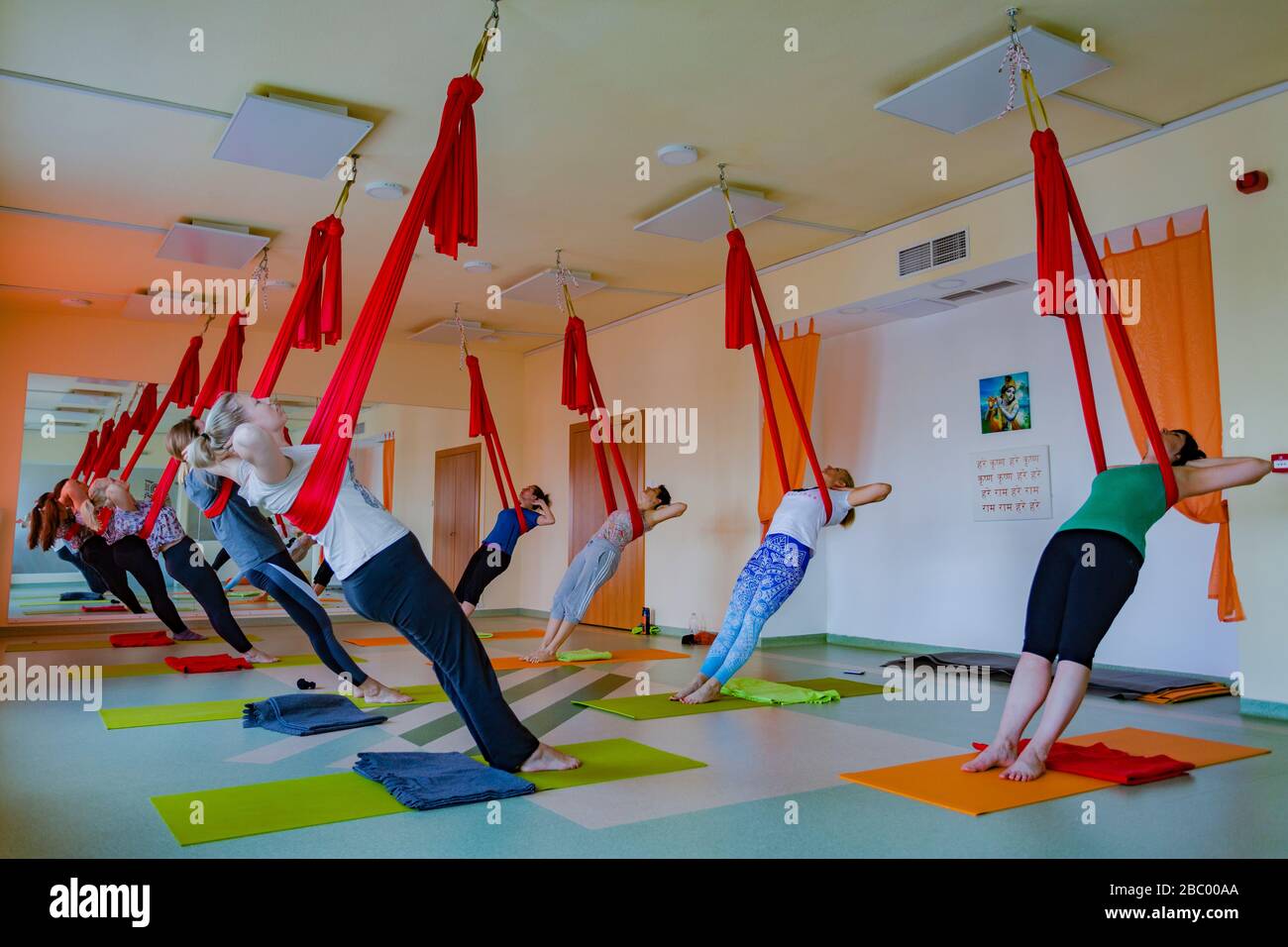 Aerial yoga class in progress Stock Photo - Alamy