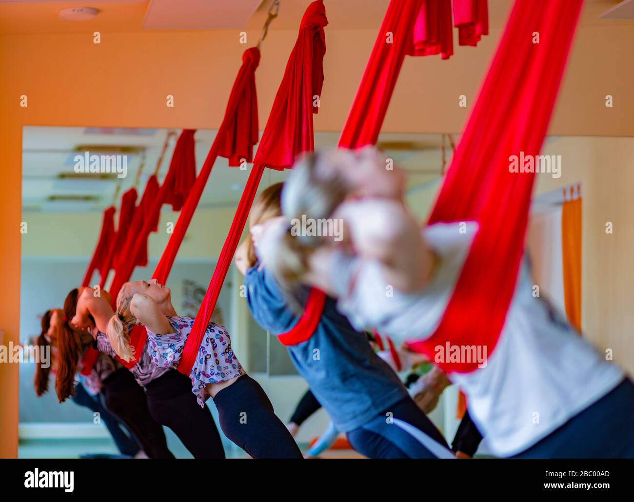 Aerial yoga class in progress Stock Photo - Alamy