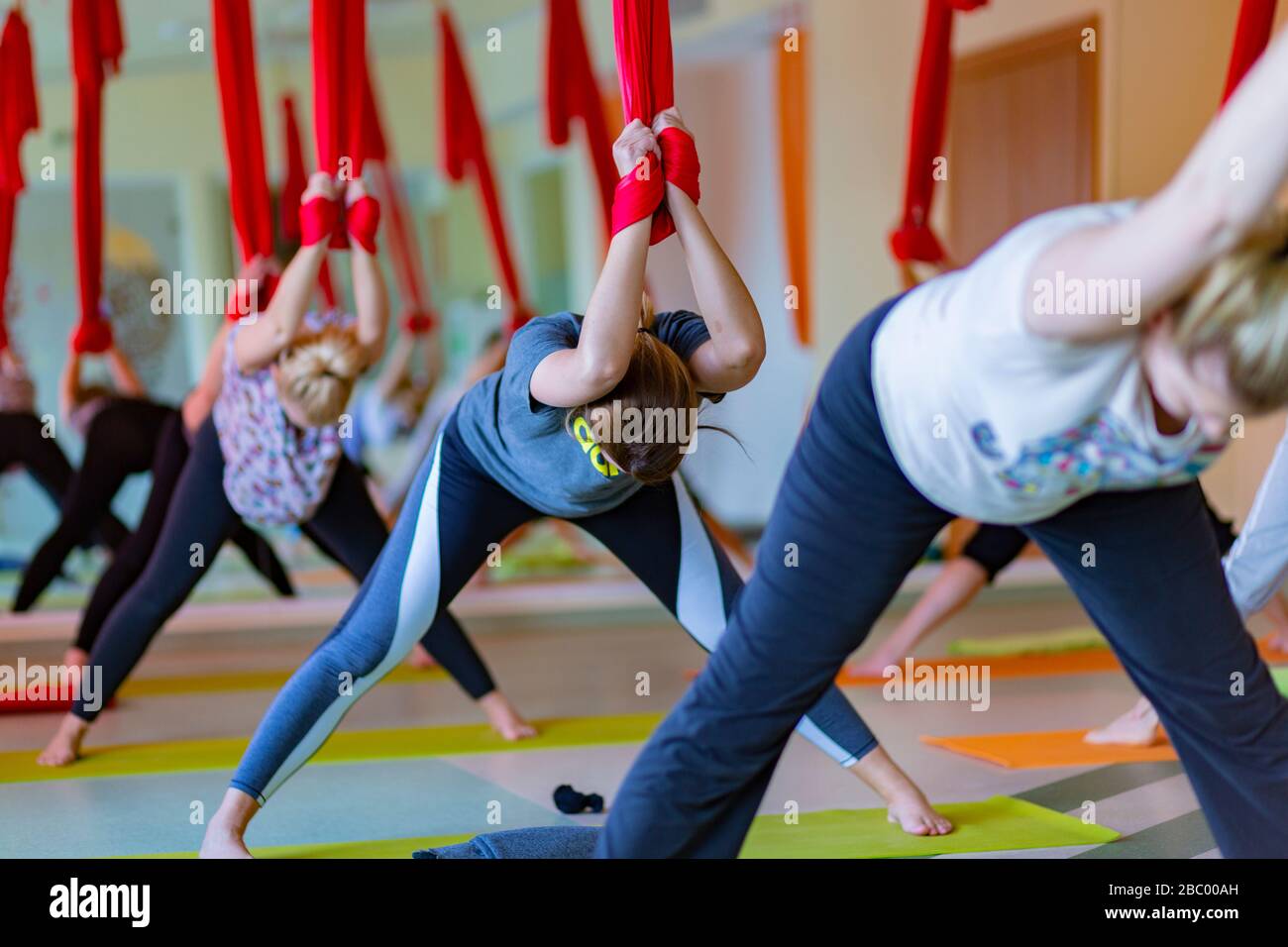 Aerial yoga class in progress Stock Photo - Alamy