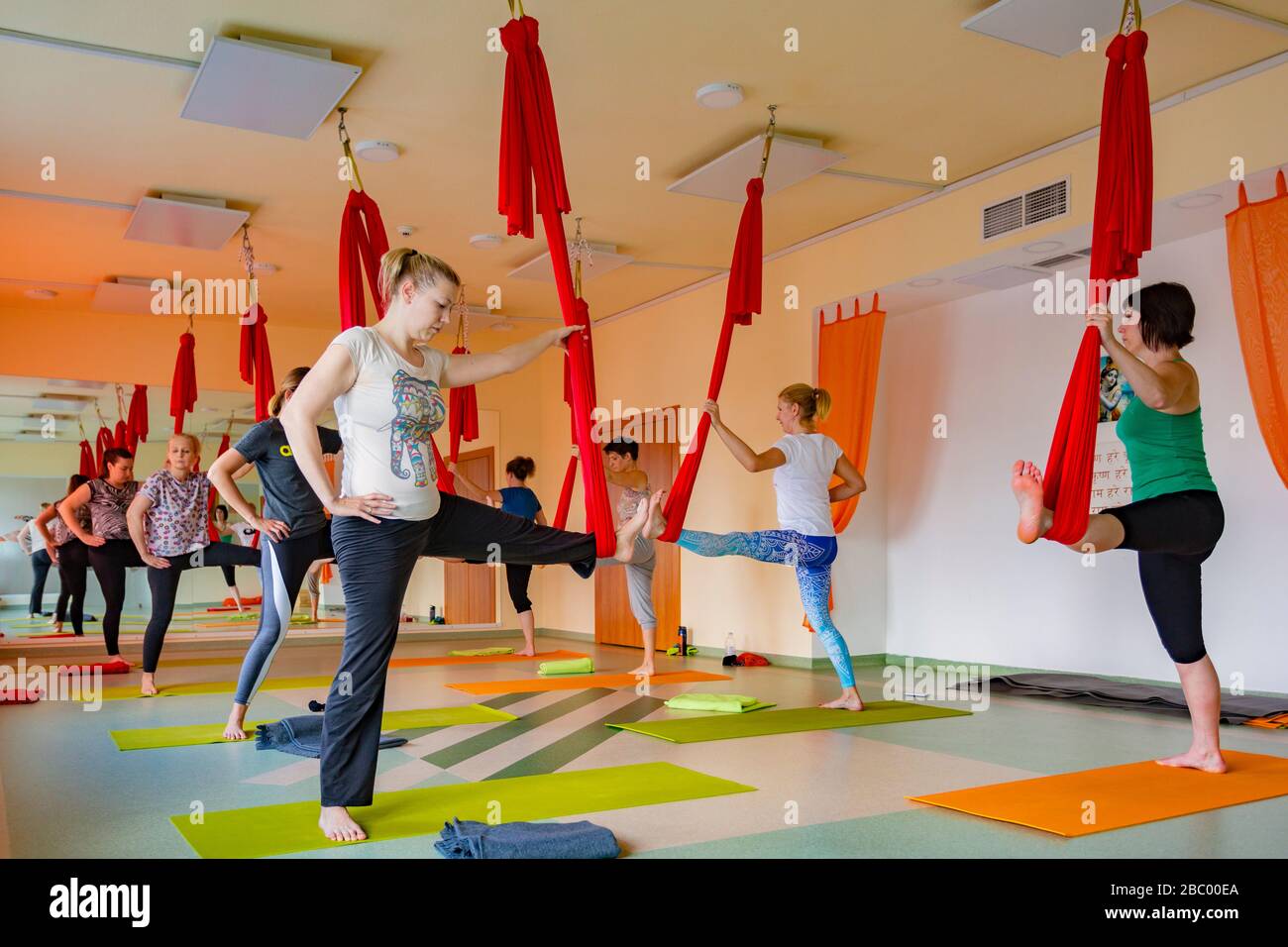 Aerial yoga class in progress Stock Photo - Alamy