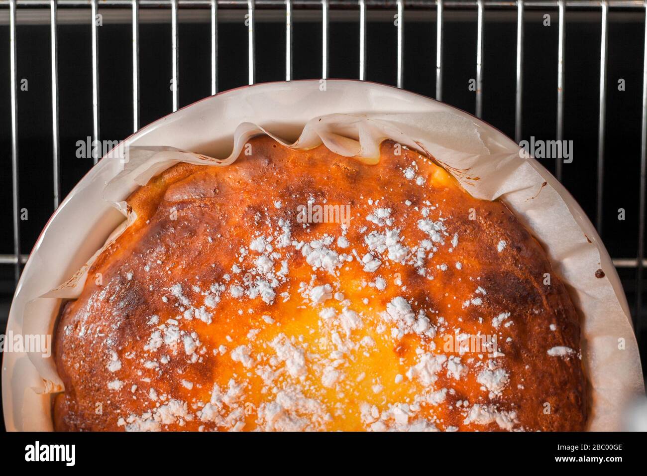 Oven baked cottage cheese casserole. In red baking dish Stock Photo - Alamy