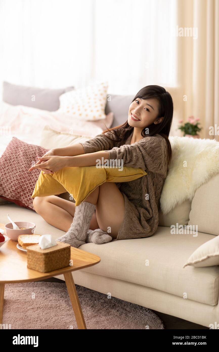 Young woman eating oatmeal porridge hi-res stock photography and images ...