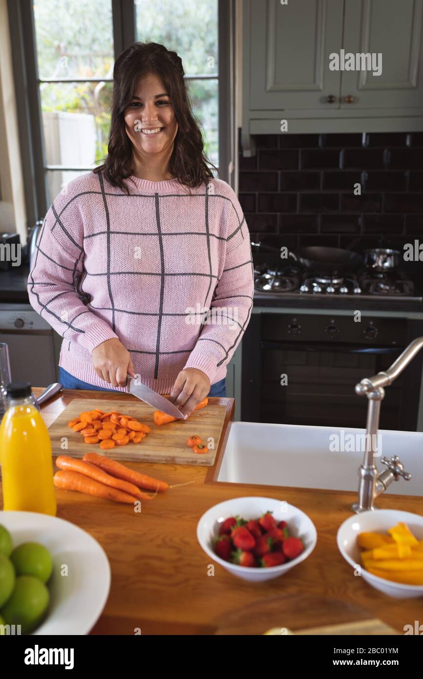 Plus size female vlogger self isolating cooking at home Stock Photo - Alamy
