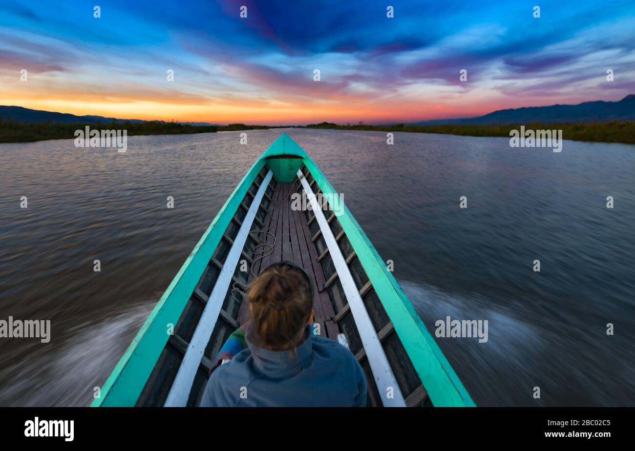 Tourist in Myanmar - Young woman enjoys a boat ride on Inle lake Stock ...