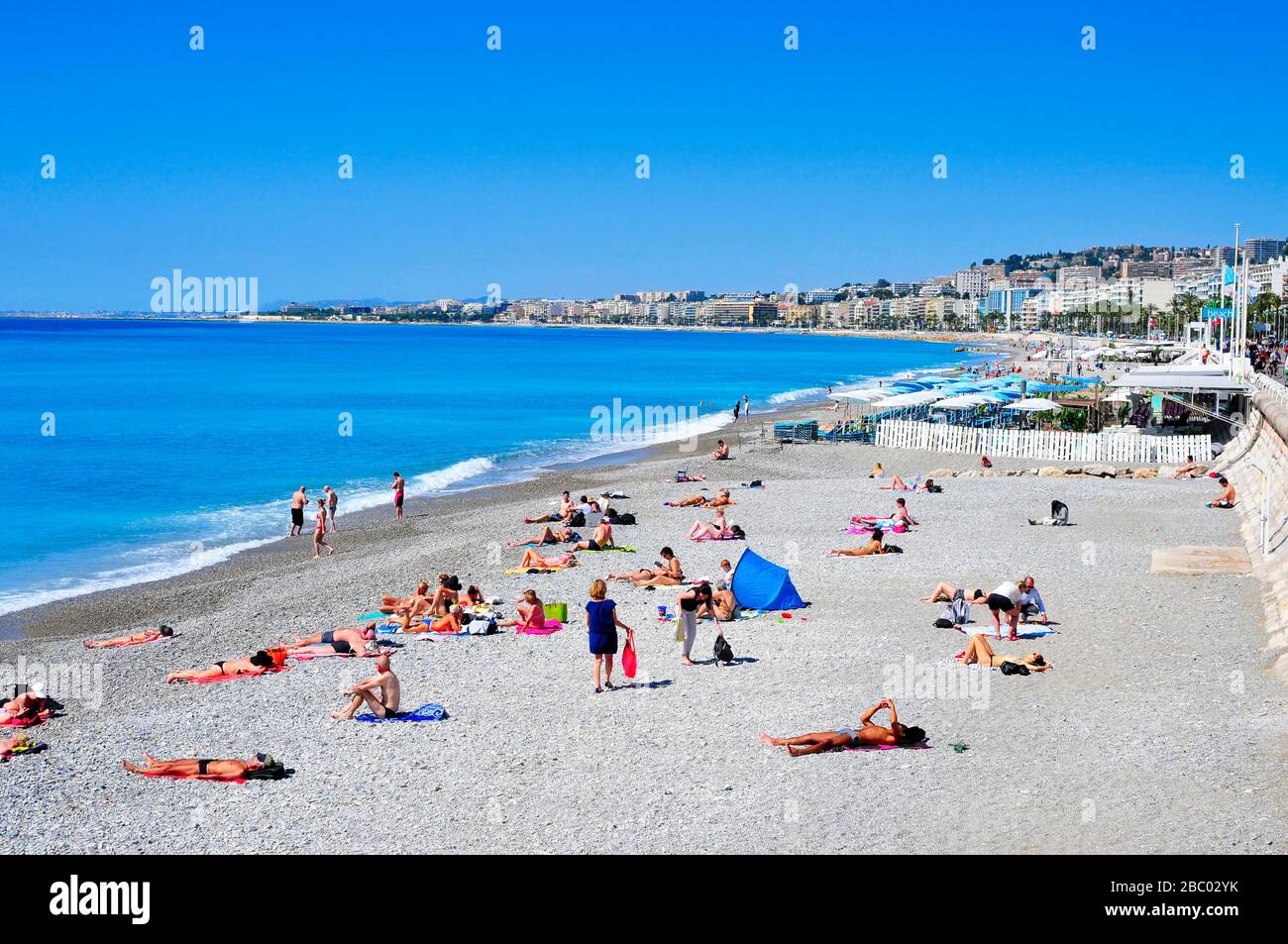 NICE, FRANCE - MAY 16: People sunbathing on the beach on May 16, 2015 ...