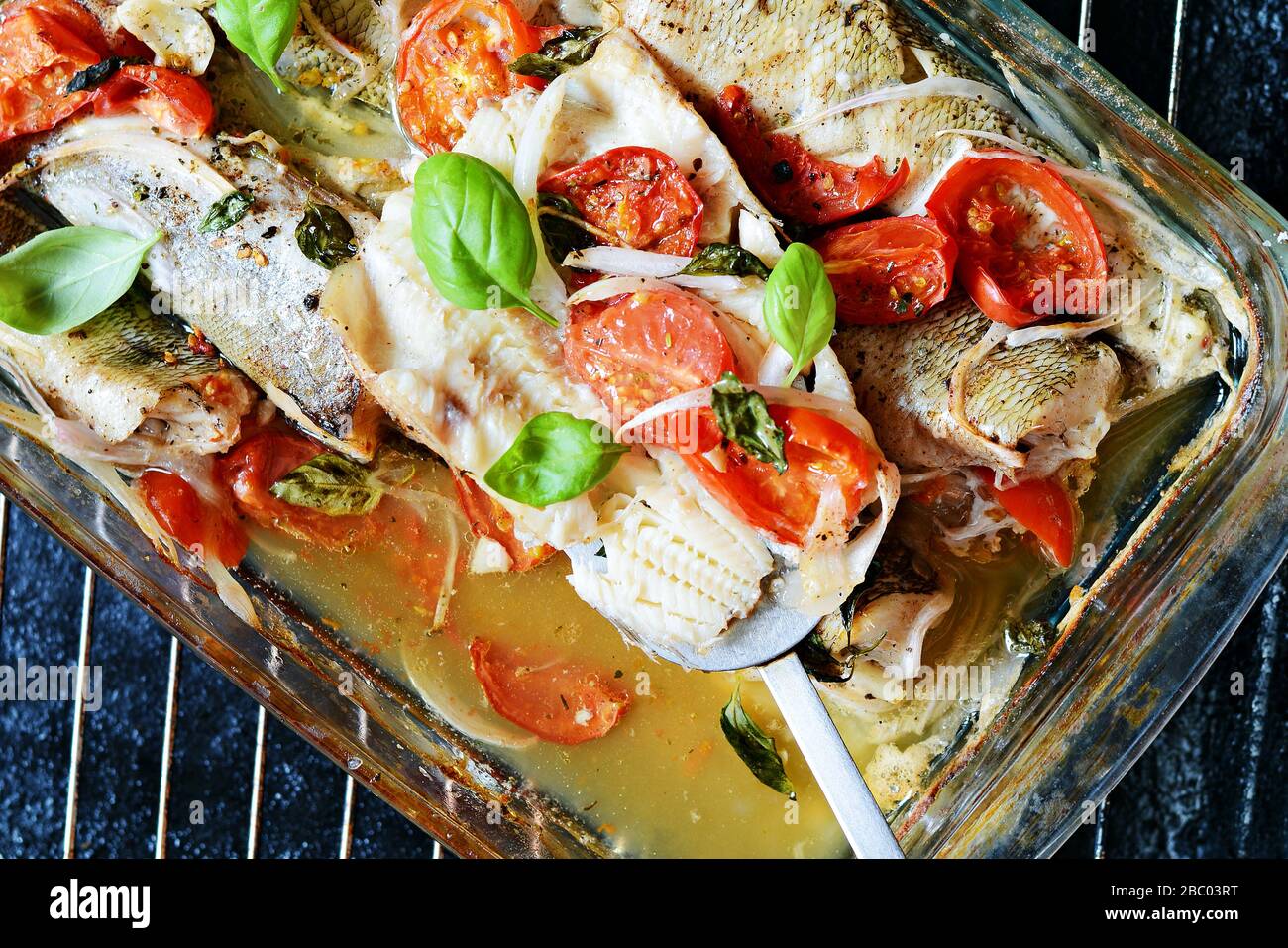 White fish (pollock, cod, hake) baked with tomatoes, Italian herbs and ...