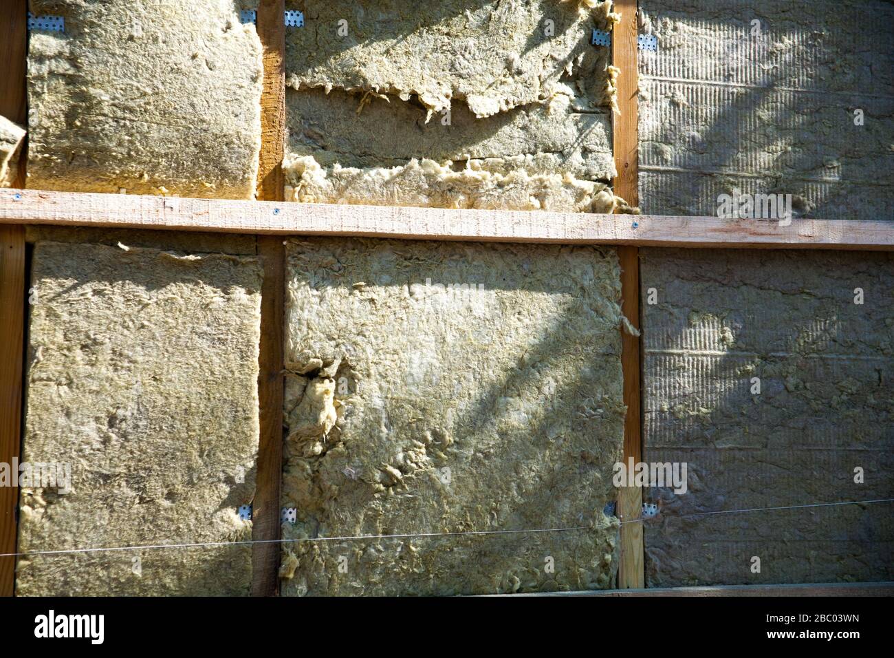 warming the walls of a stone house with a stone wool heater. Ecological ...