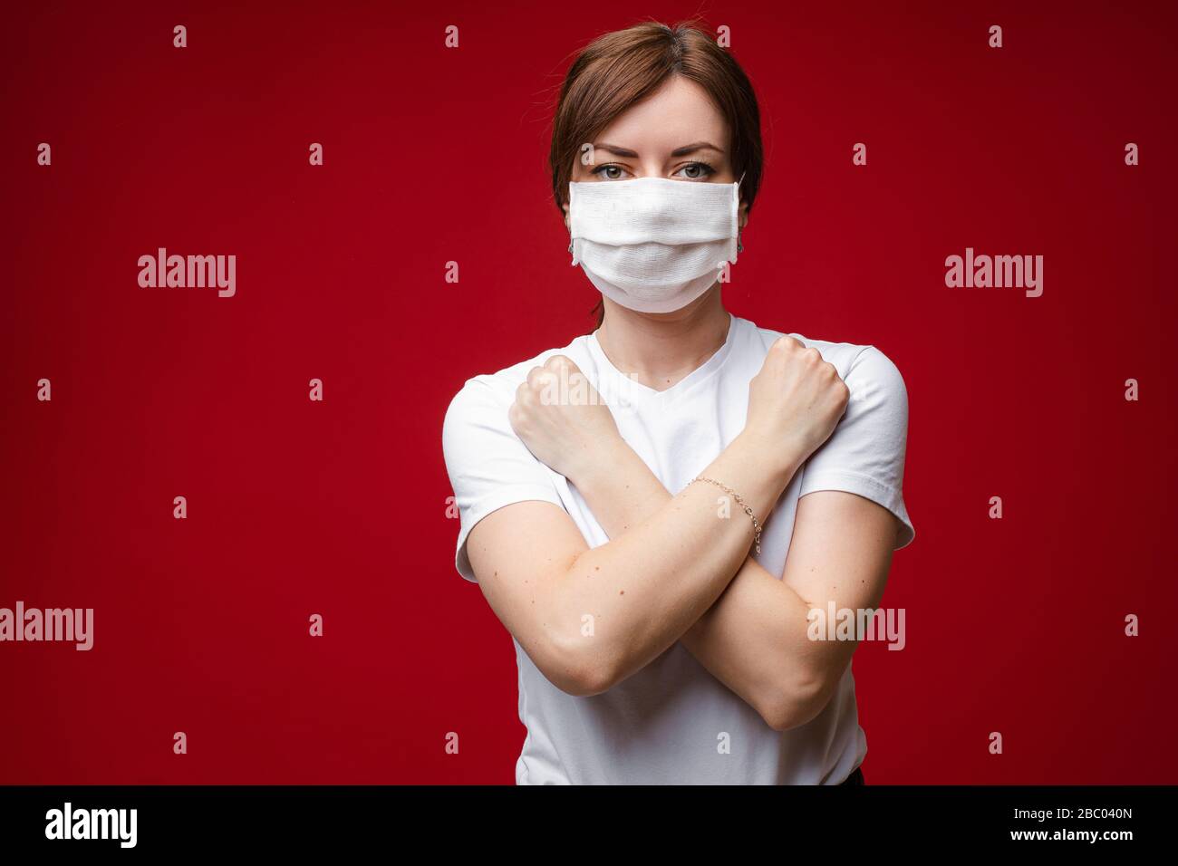 Woman in aseptic mask with crossed arms on her chest Stock Photo - Alamy