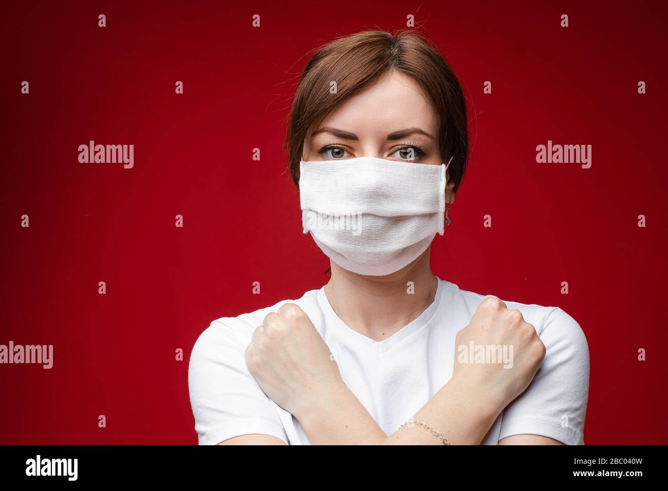 Woman in aseptic mask with crossed arms on her chest Stock Photo - Alamy