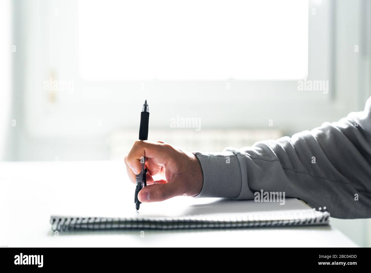Student doing homework at the desk in the bedroom Stock Photo - Alamy