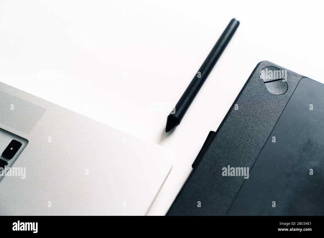 Workspace of a designer with a graphics tablet, stylus and computer ...