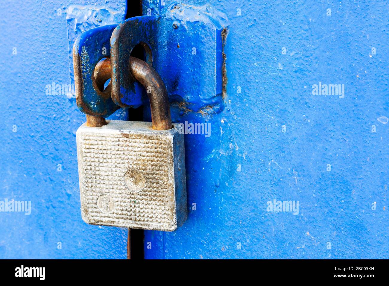 old iron castle on a blue iron gate Stock Photo - Alamy