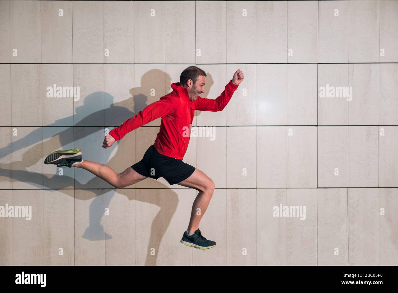 Man jumping hurdle hi-res stock photography and images - Alamy