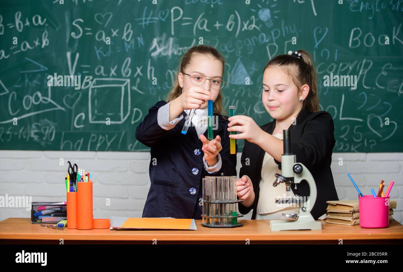 science experiments in laboratory. Little girls scientist with ...
