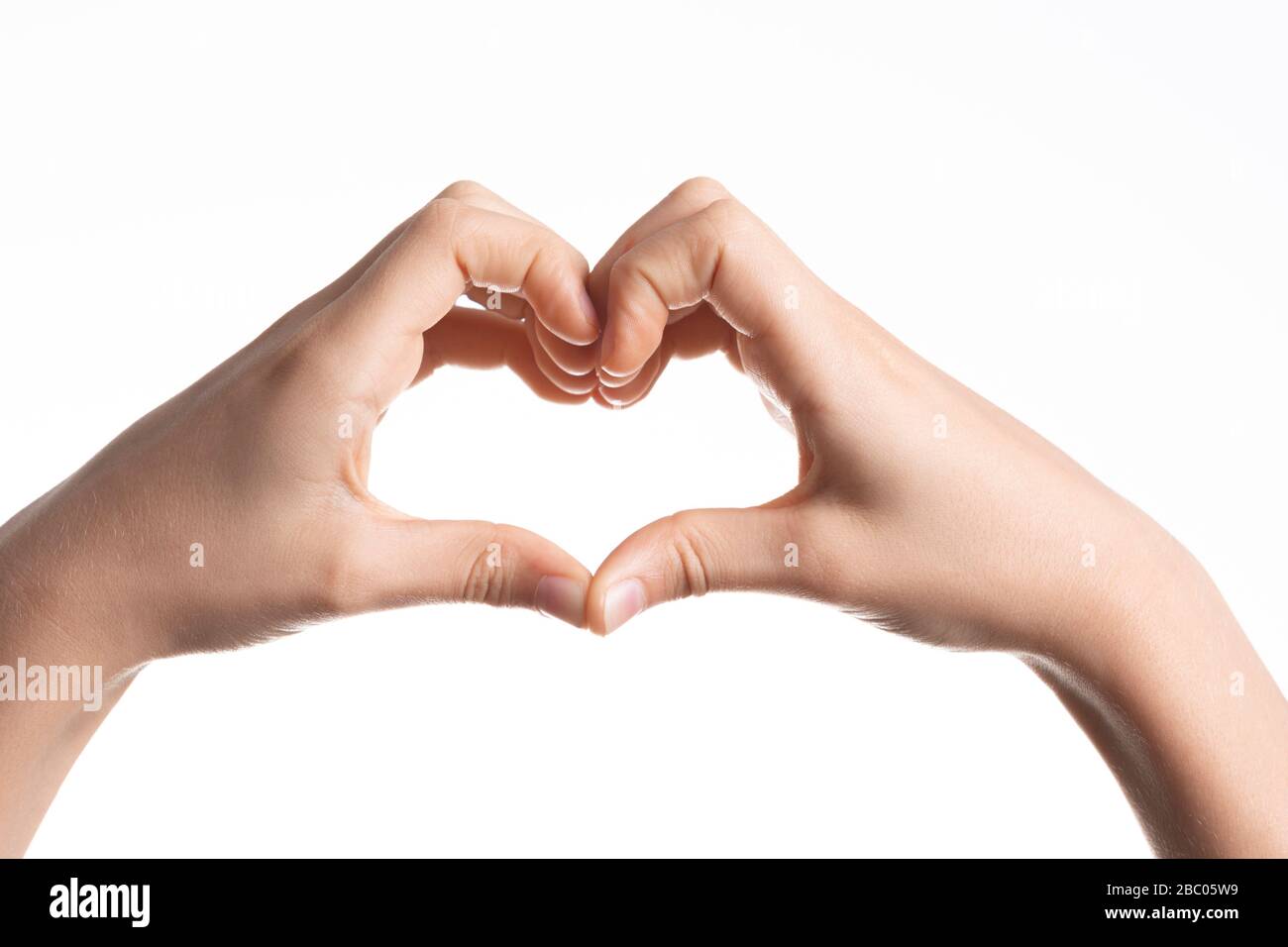 Kid hands forming a heart shape on white background Stock Photo - Alamy