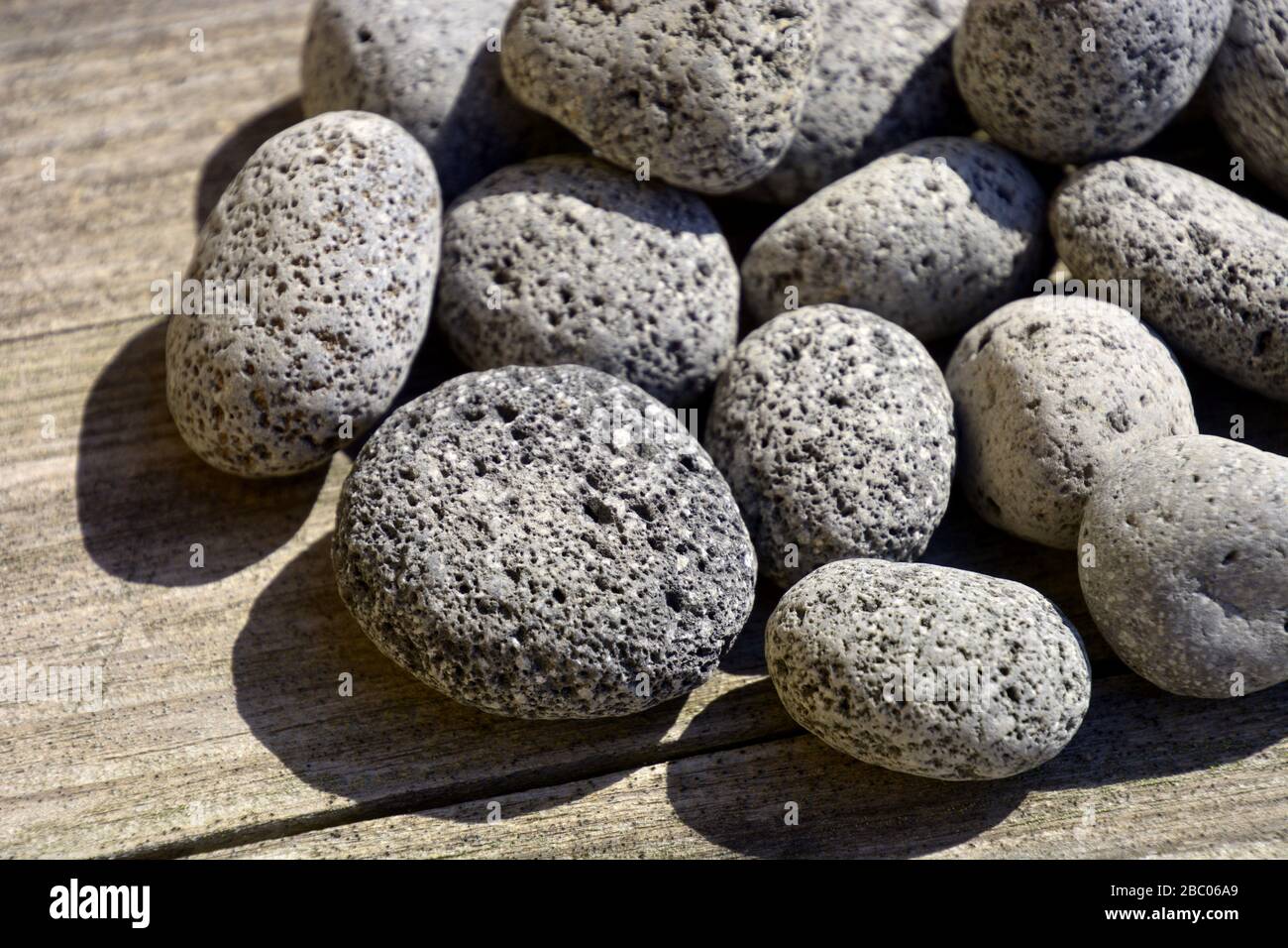 volcanic lava pebbles background, porous lava stone textured surface ...