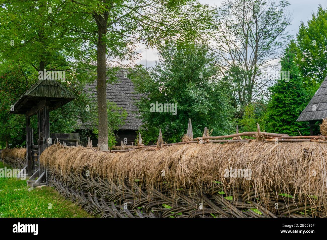 The hay and wood fence in front of Marinca House, Maramures Village ...