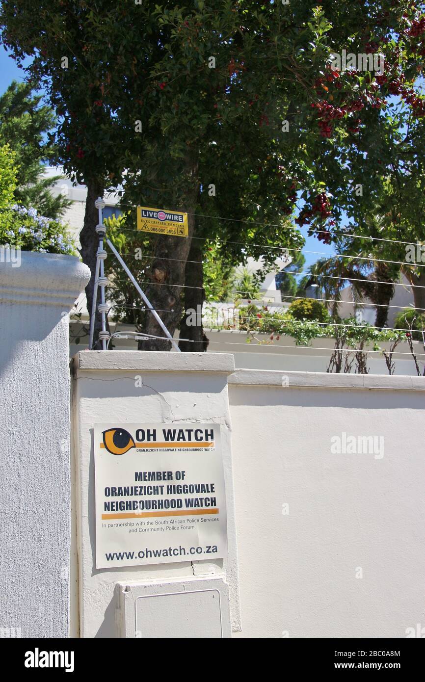 Warning sign against burglars on a house wall, in the district ...