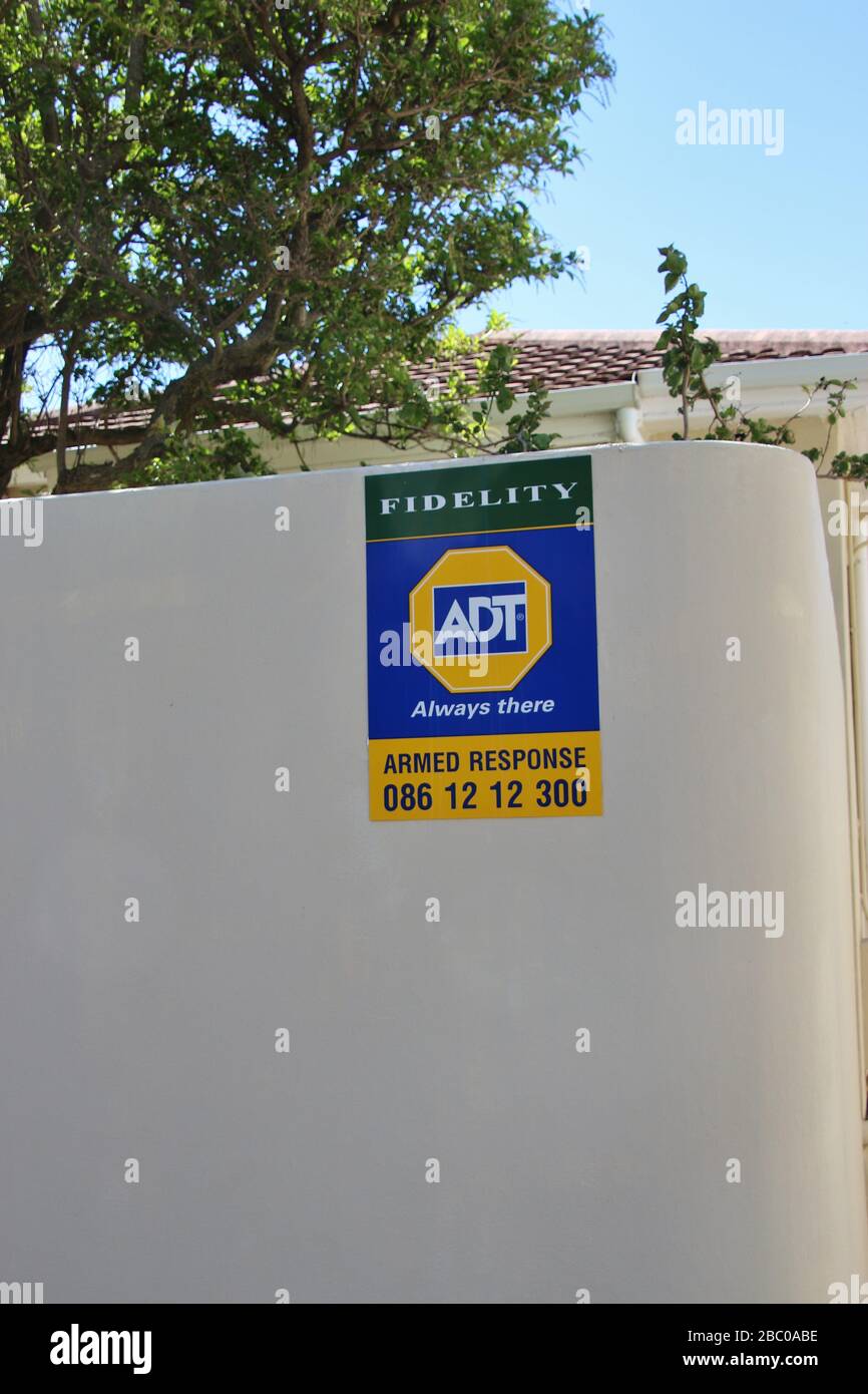 Warning sign against burglars on a house wall, in the district ...