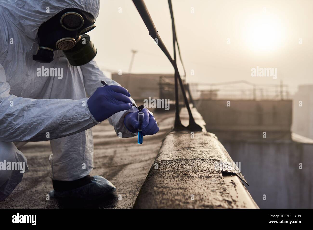 Cropped snapshot of a scientist conducting laboratory test, using ...