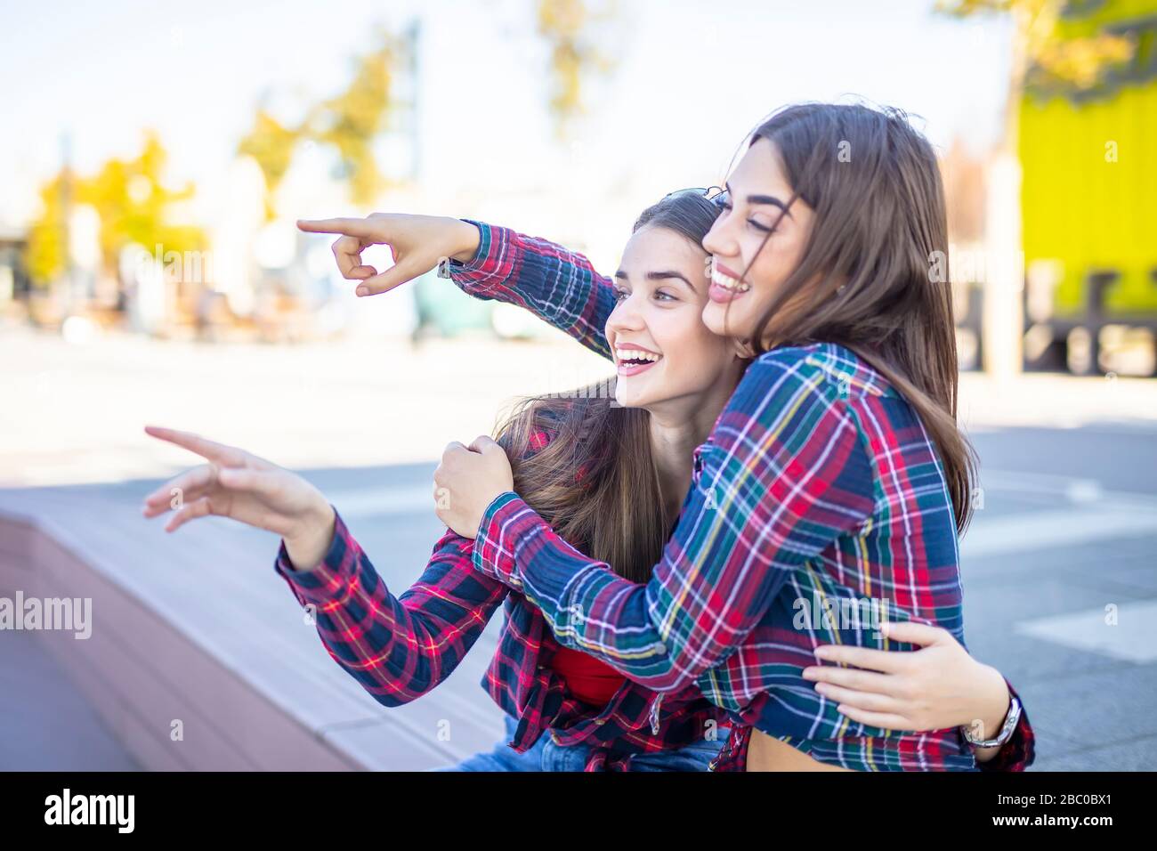Two best female friends embracing together outdoors Stock Photo - Alamy