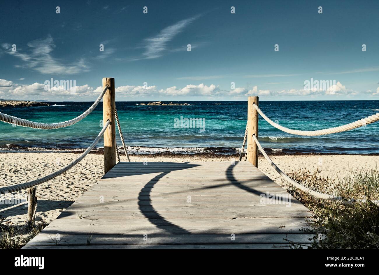 The path to a sea beach, a path consists of wooden boards, on each side ...