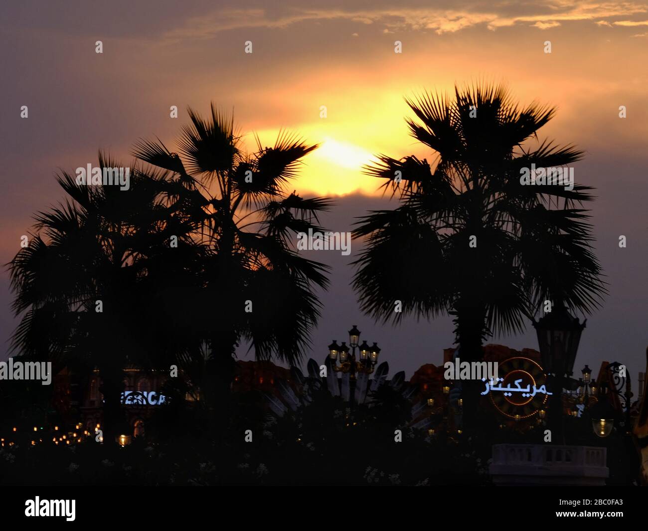 Sunset at Global Village, Dubai, UAE. Global Village combines cultures ...