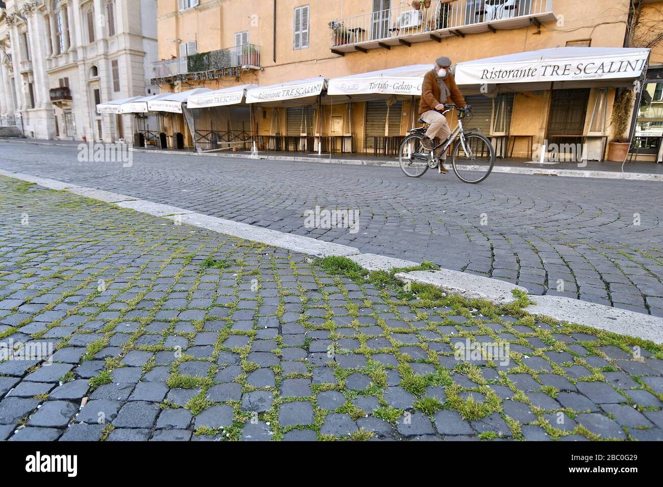 Rome, Piazza Navona looks like a green lawn, the grass grows among the ...