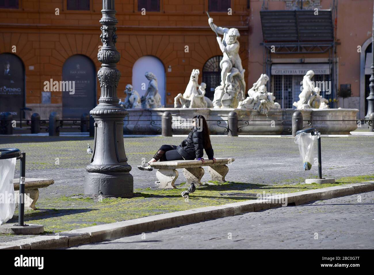 Rome, Piazza Navona looks like a green lawn, the grass grows among the ...