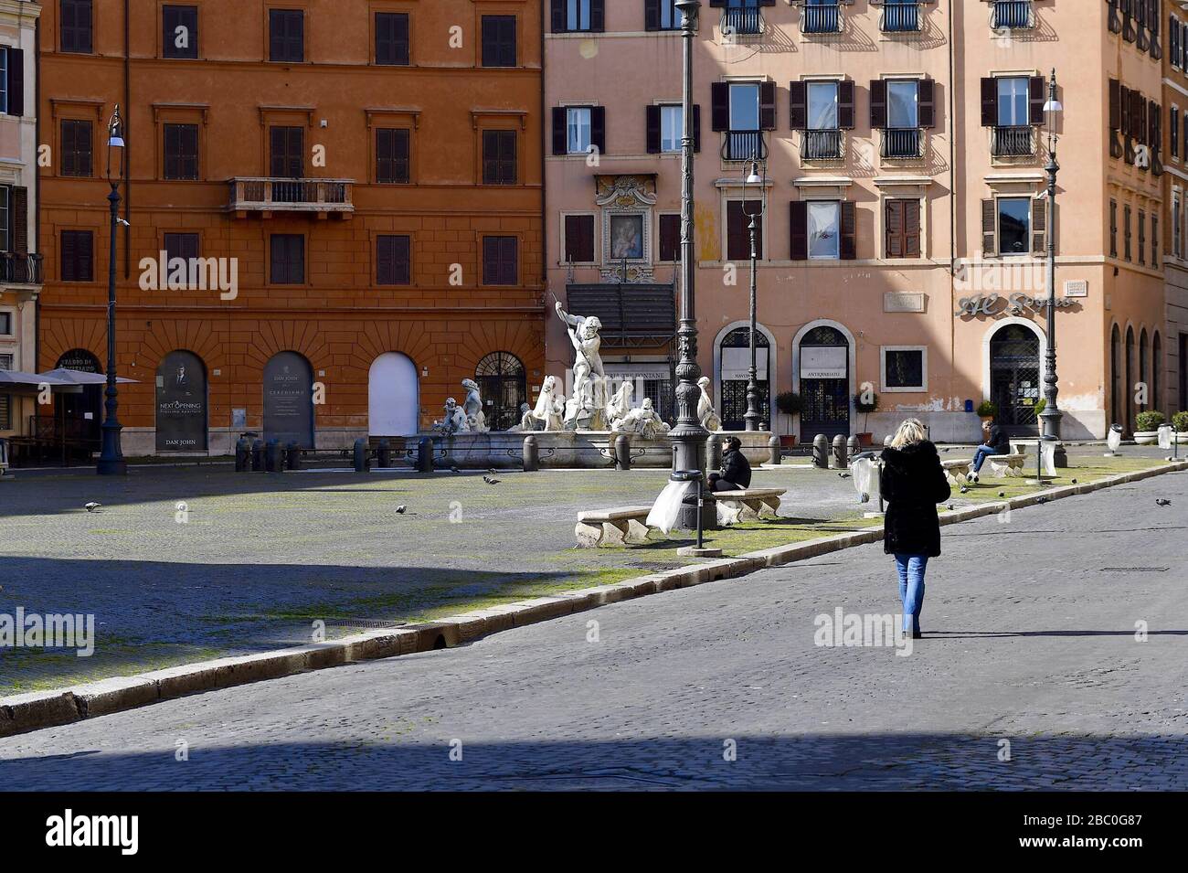 Rome, Piazza Navona looks like a green lawn, the grass grows among the ...