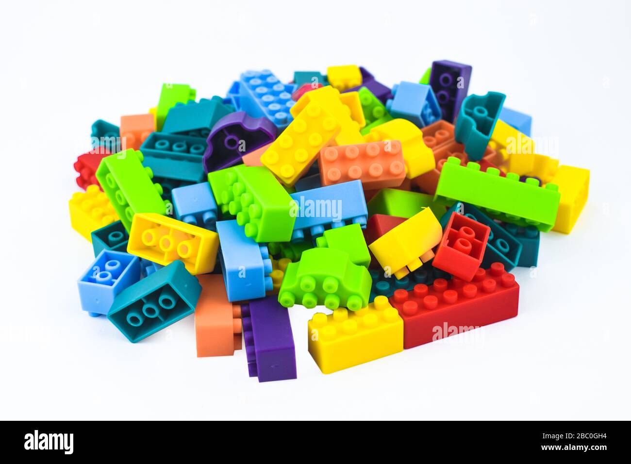 Portrait of different color building blocks gathered together before an ...