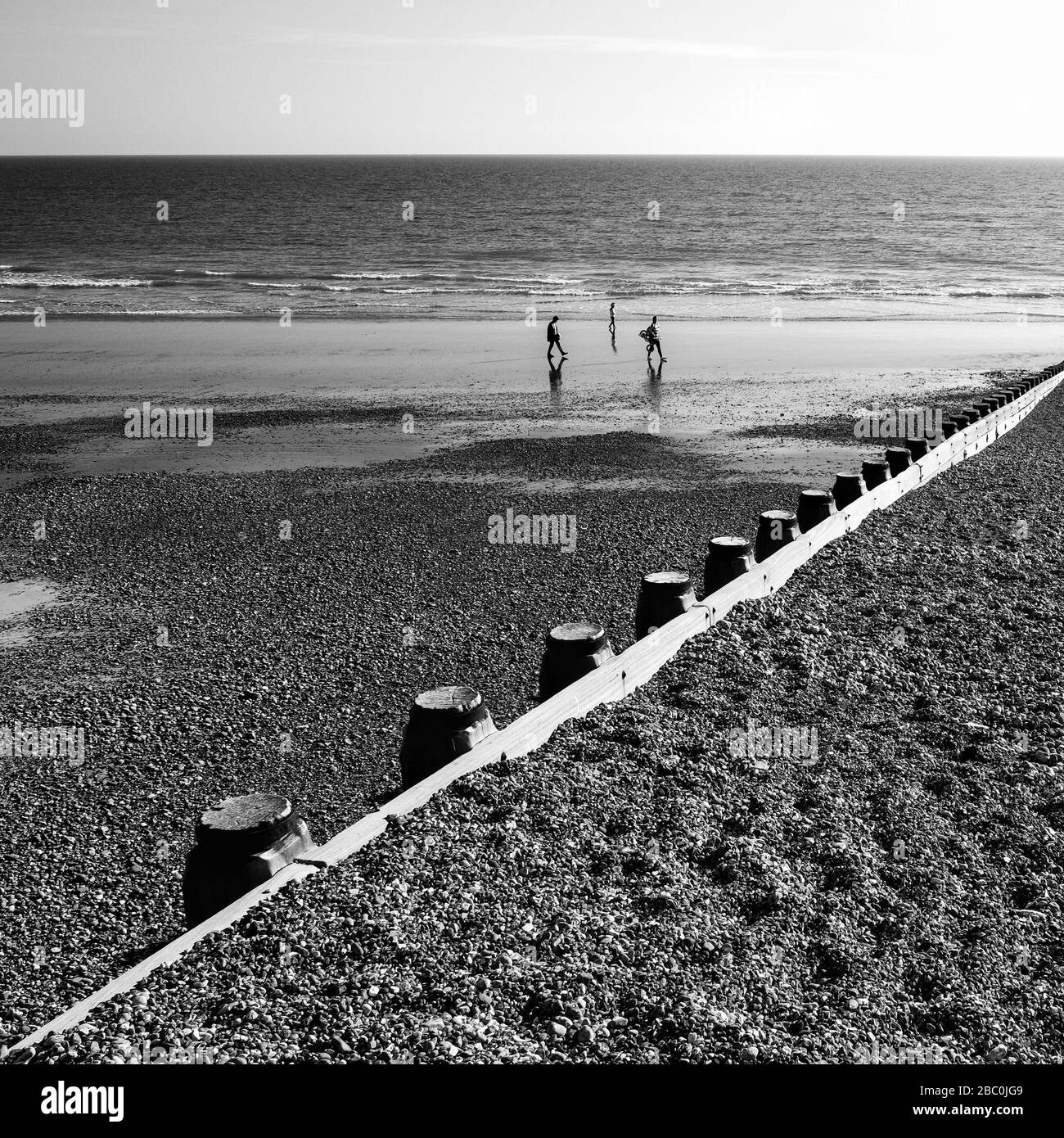 Strolling along beach Black and White Stock Photos & Images - Alamy