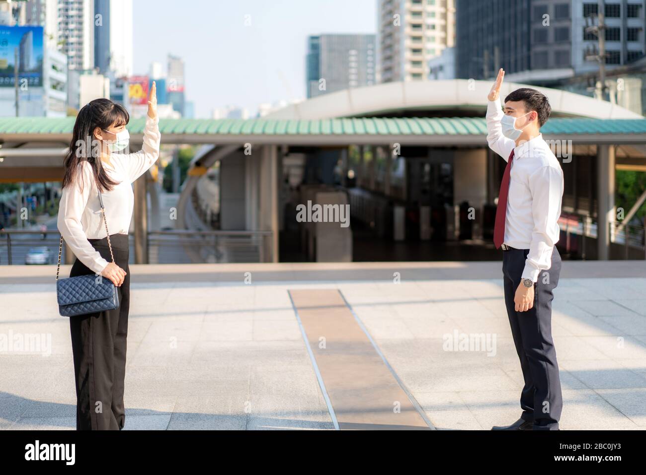 Asian business man and woman greet and say hello with business ...
