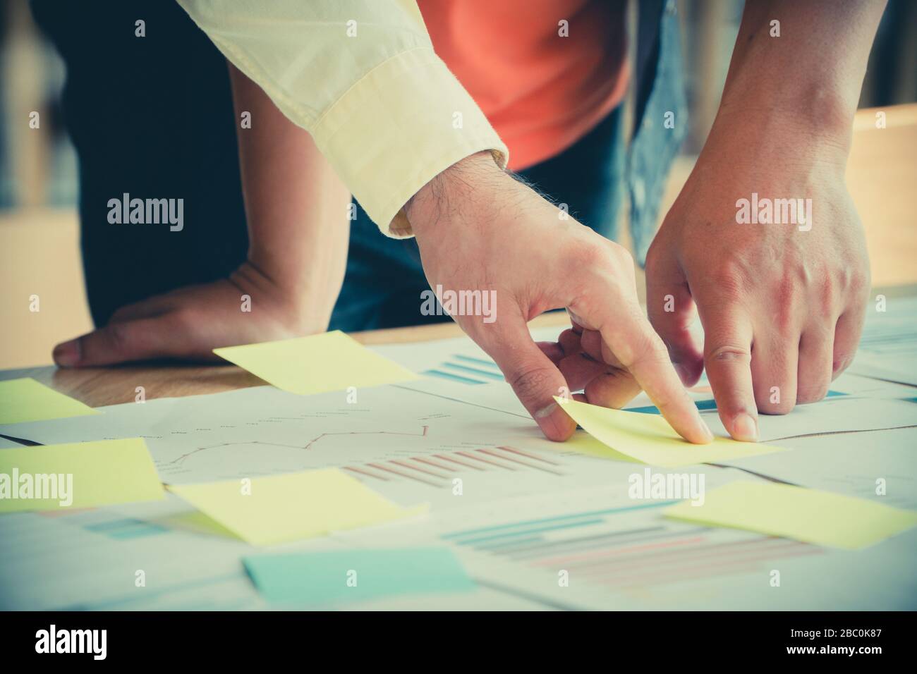 Group of business people standing meeting with colleagues in meeting ...