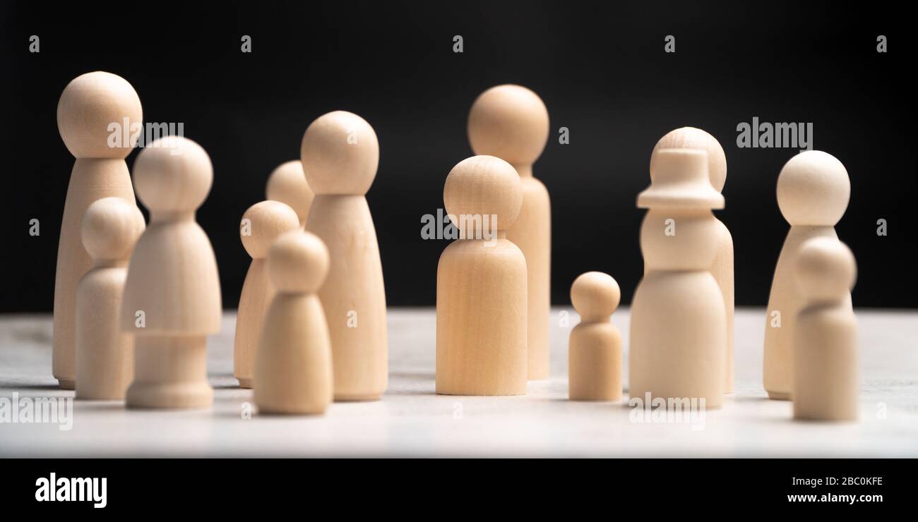 Many wooden human figures, Man and woman standing. Concept of Human ...