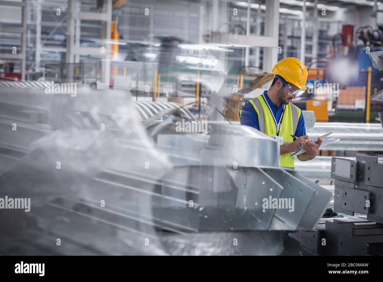 Inspecting warehouse worker in hi-res stock photography and images - Alamy