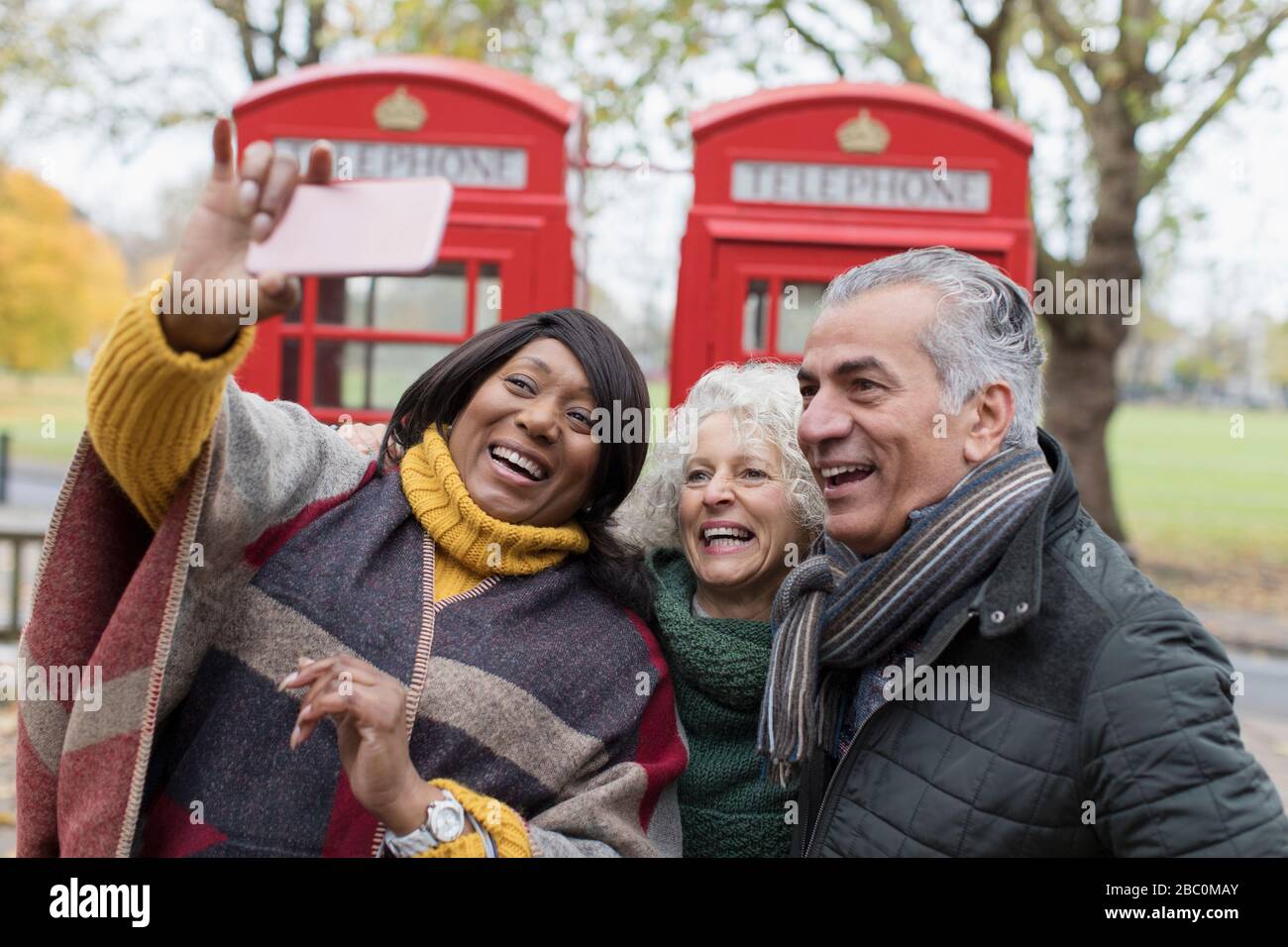 Young women in a photo booth in the Shibuya district of Tokyo, Japan ...