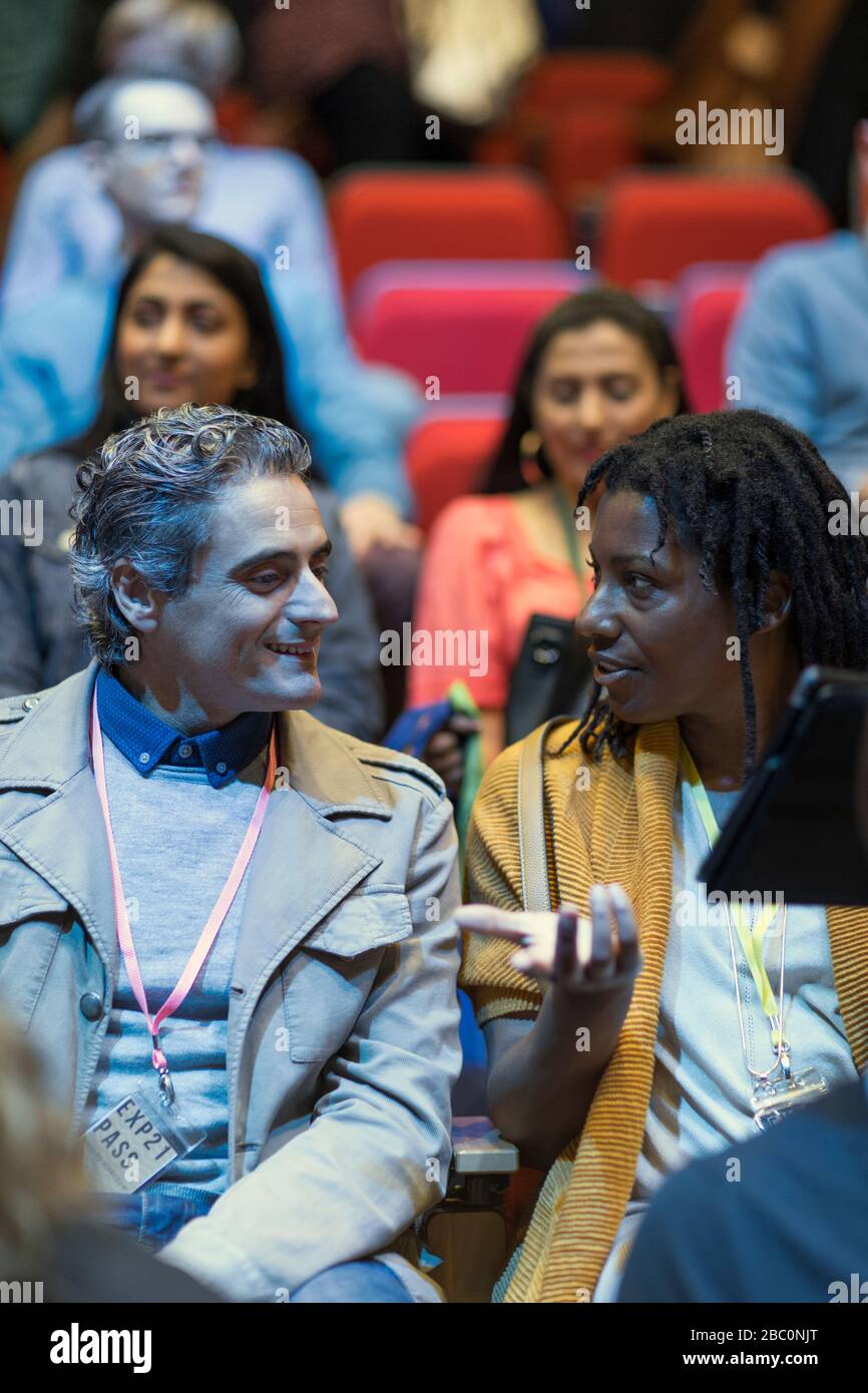 Business people talking in conference audience Stock Photo - Alamy