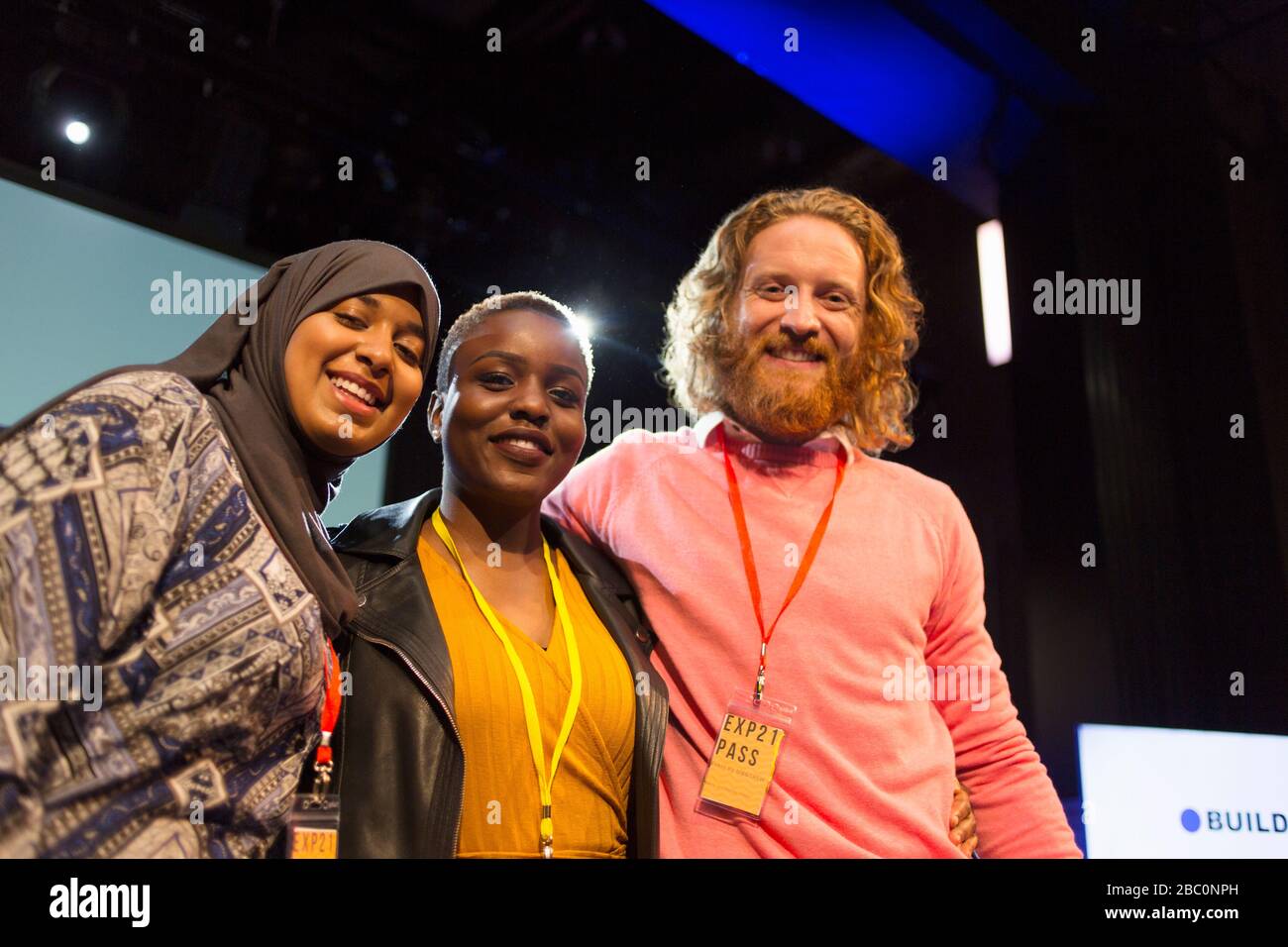 Portrait smiling conference speakers Stock Photo - Alamy