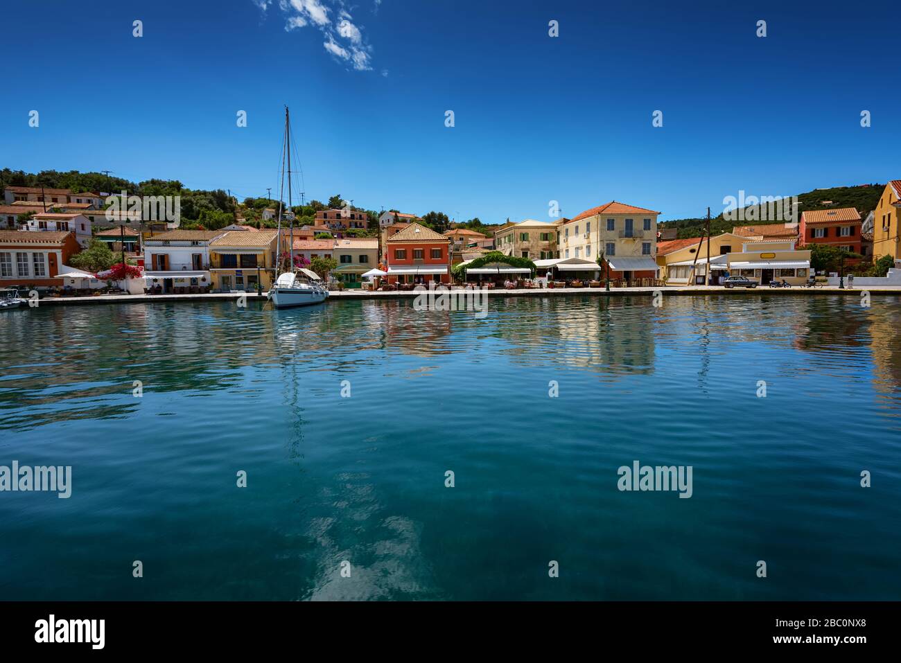 Paxos Island, Greece. View of beautiful Loggos Harbor sea bay with calm ...