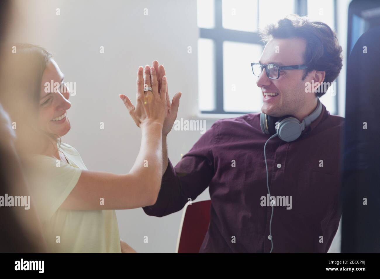 Coworker high five hi-res stock photography and images - Alamy