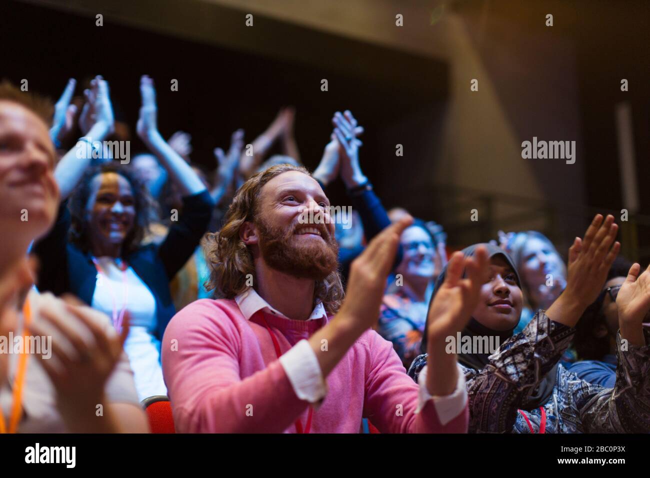 Smiling, enthusiastic man clapping in audience Stock Photo - Alamy Smiling, enthusiastic man clapping in audience Stock Photo - Alamy