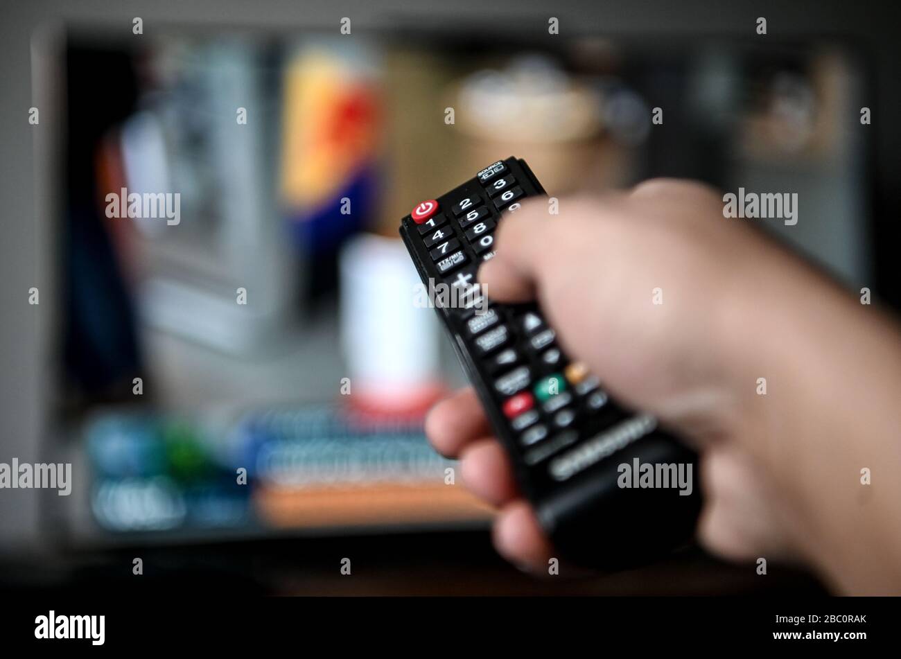 Man switches channels remote control hi-res stock photography and ...
