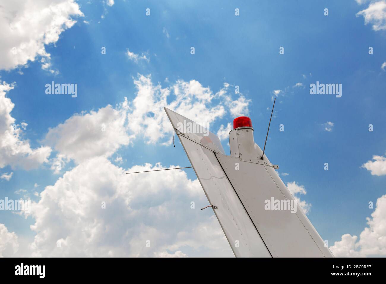 Plane tail against blue sky. Tail section of small aircraft Stock Photo ...