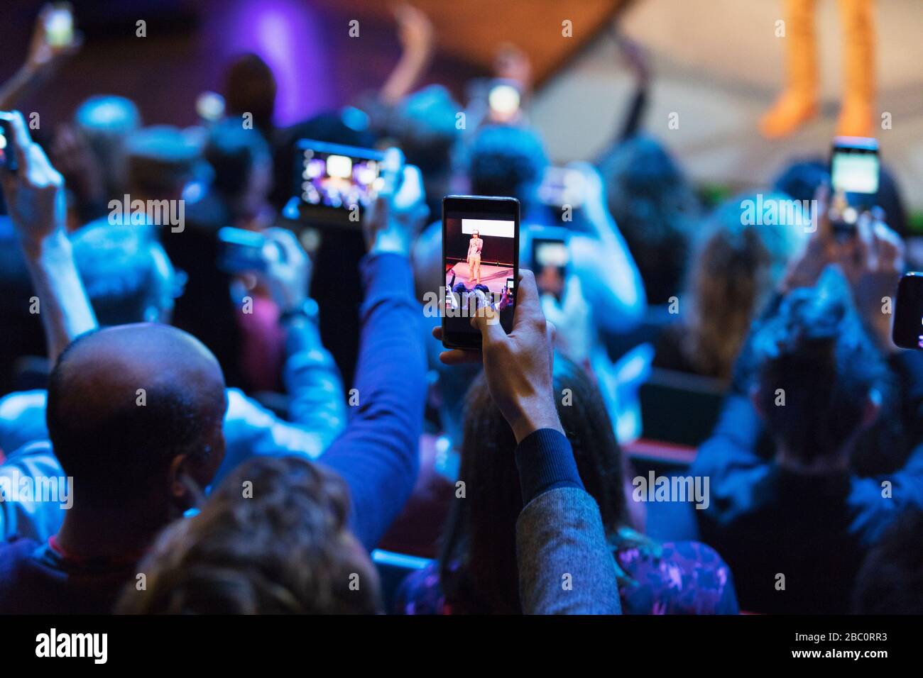 Audience using camera phones Stock Photo - Alamy