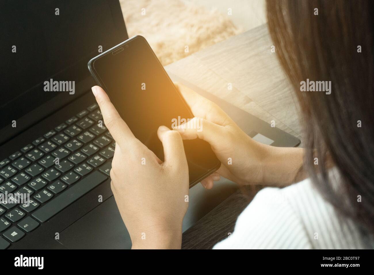 Cropped image of professional business woman working at home office via ...