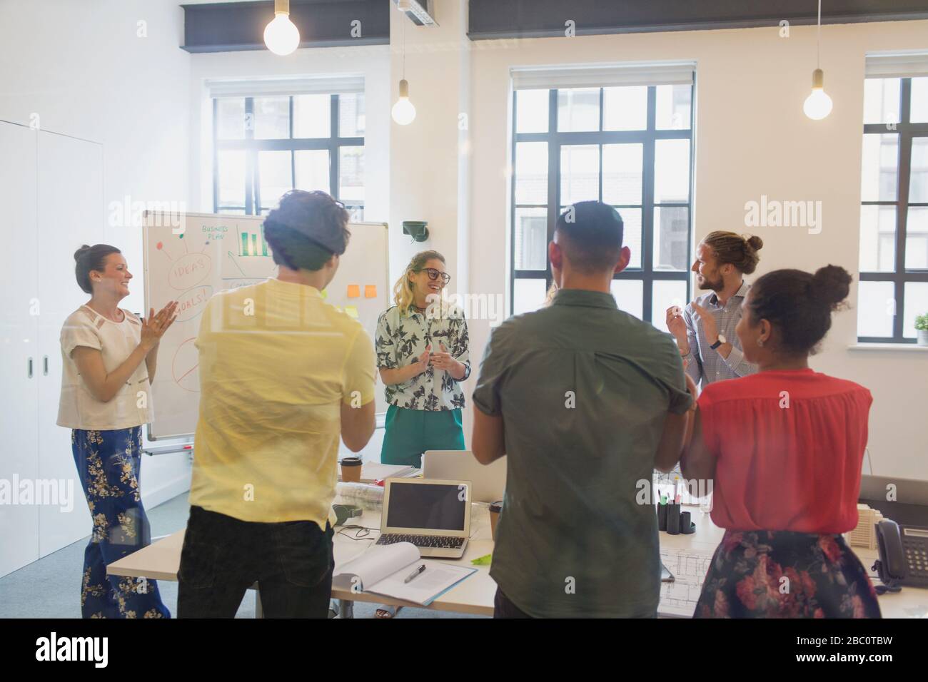 Enthusiastic business people clapping in conference room meeting Stock ...
