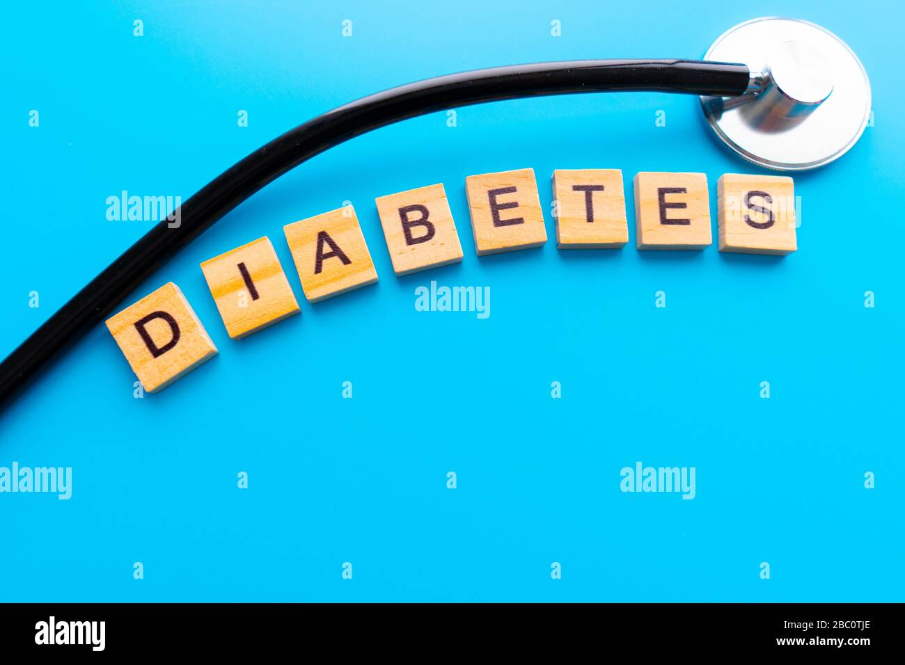 Wooden text Diabetes. Diabetes concept. Syringe, Glucometer or Glucose ...