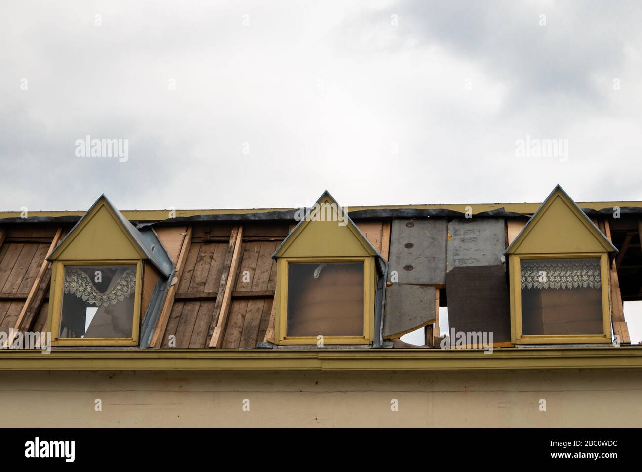 image of an old demolition building with a partially demolished roof ...
